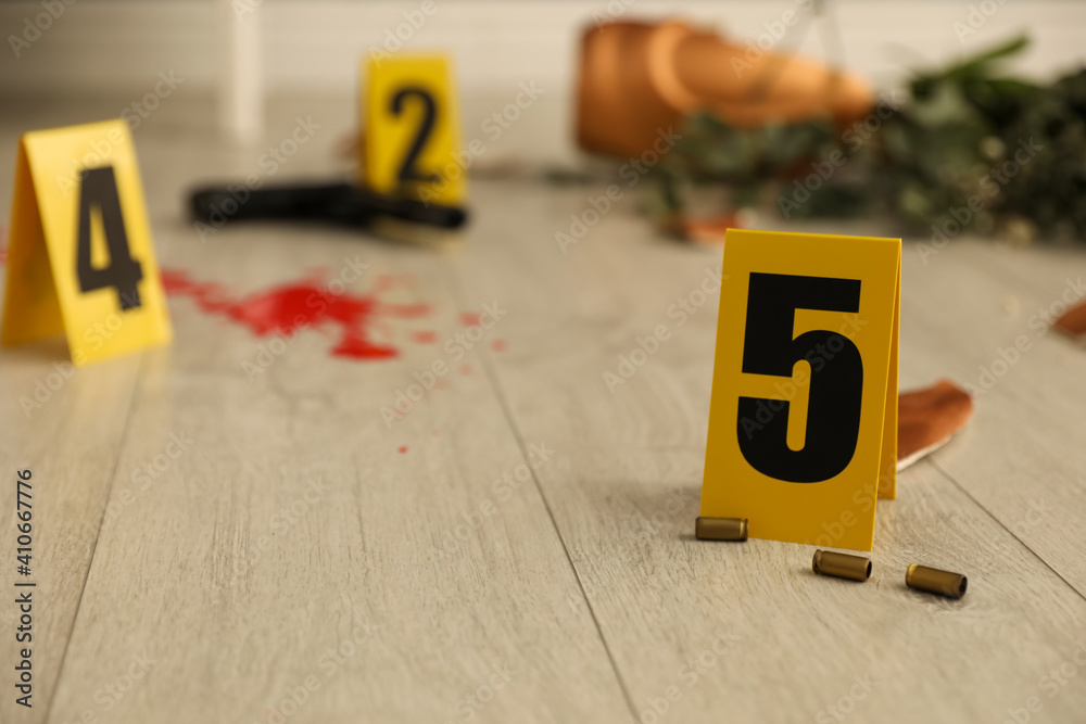 Crime scene markers and casings on floor indoors Stock Photo | Adobe Stock