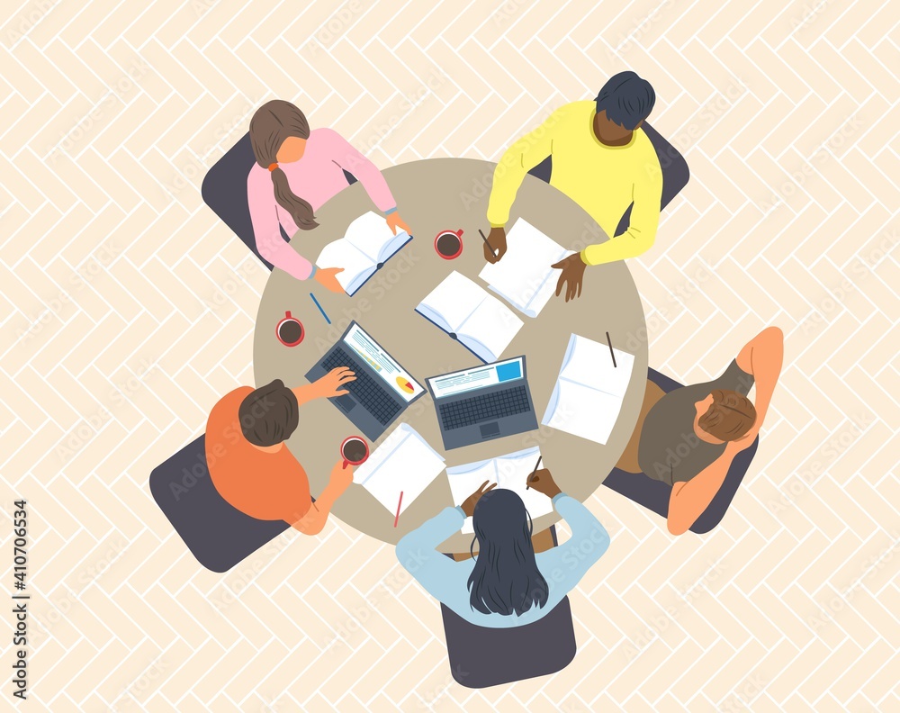 Group of diverse students are sitting at the table and studying. Top ...