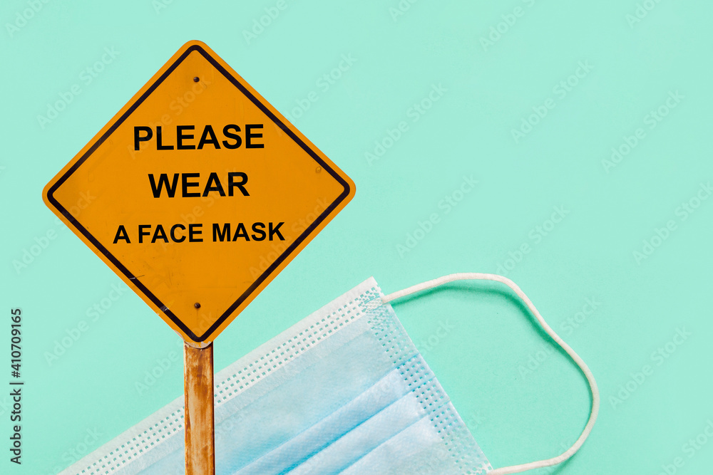 warning sign "Please wear a face mask" , COVID-19 protection policy ...