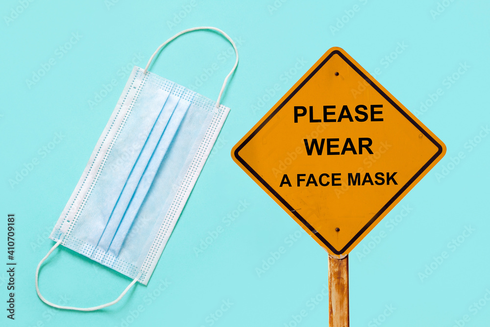 warning sign "Please wear a face mask" , COVID-19 protection policy ...