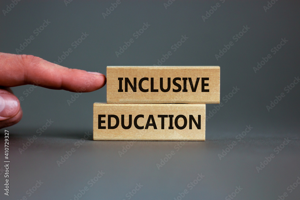 Inclusive education symbol. Wooden blocks form the words 'inclusive ...