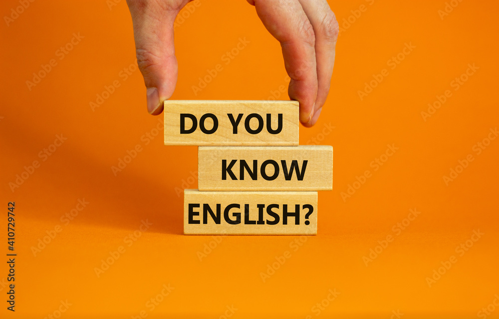 Do you know english symbol. Businessman hand. Wooden blocks with words ...