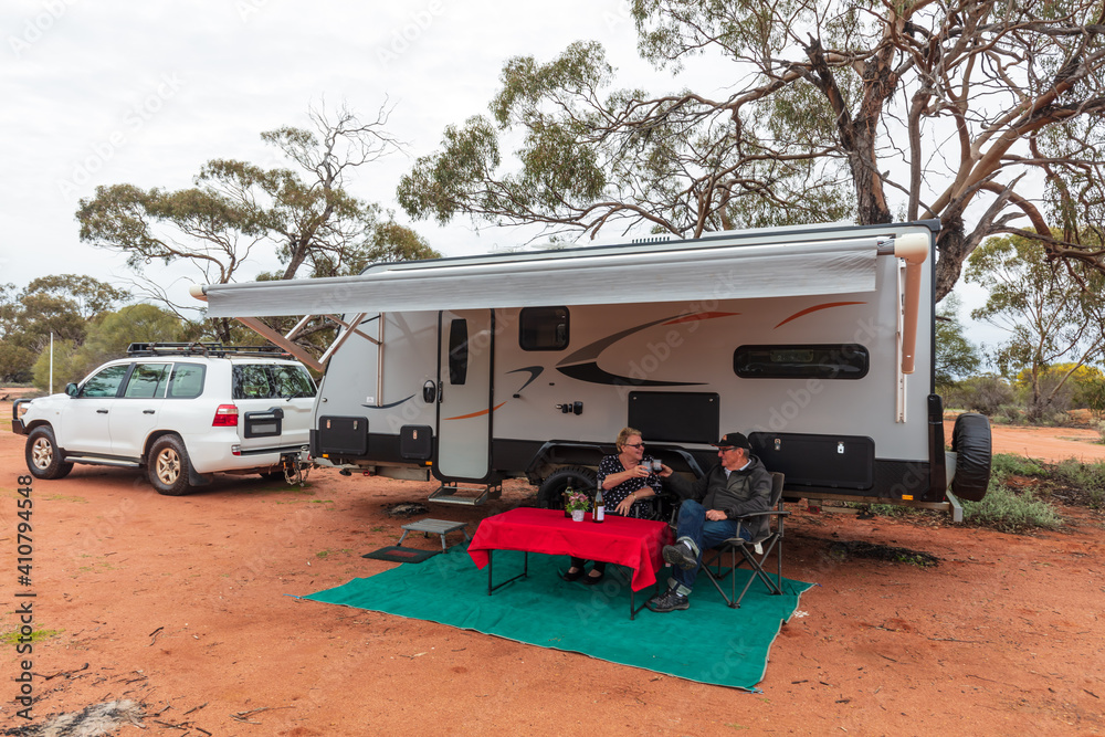 Retired Australian senior citizens known as "Grey Nomad" relax with a ...