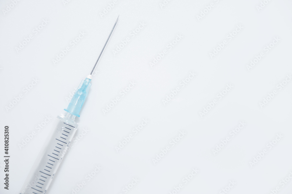 Crop one single syringe with dose of medicine or vaccine on white or ...
