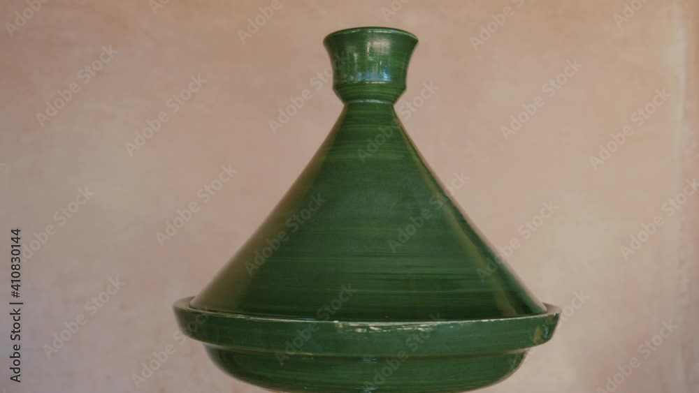 Authentic Moroccan green ceramic tagine (tajine), rotating. Traditional ...