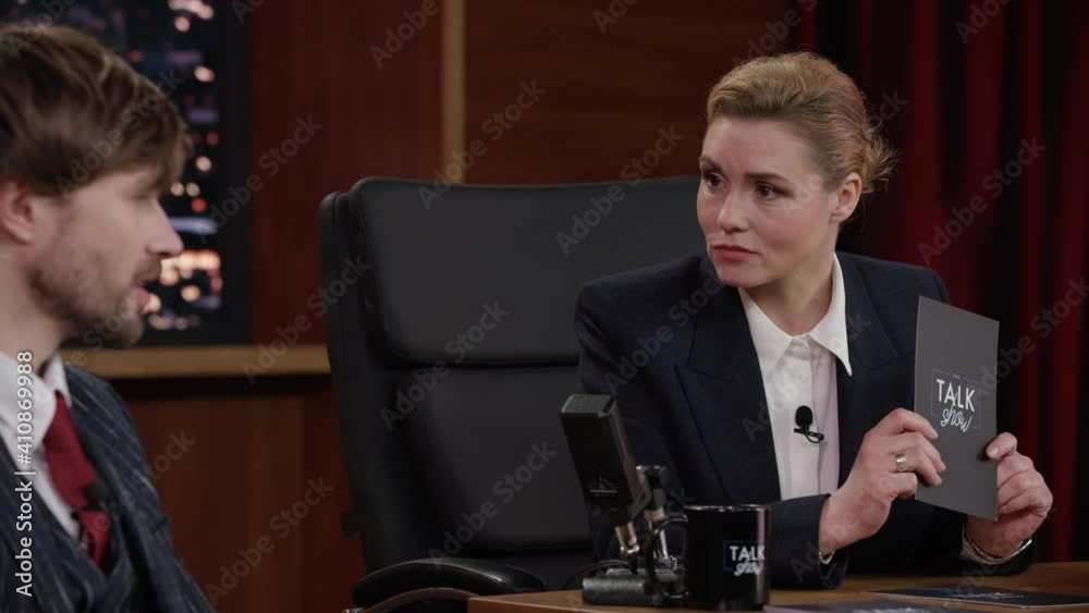 Portrait of late-night talk show female host having a conversation with ...