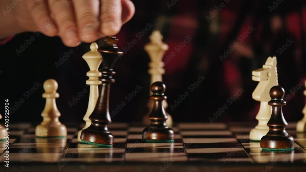 White figures win checkmate. Front view of white queen defeating black ...