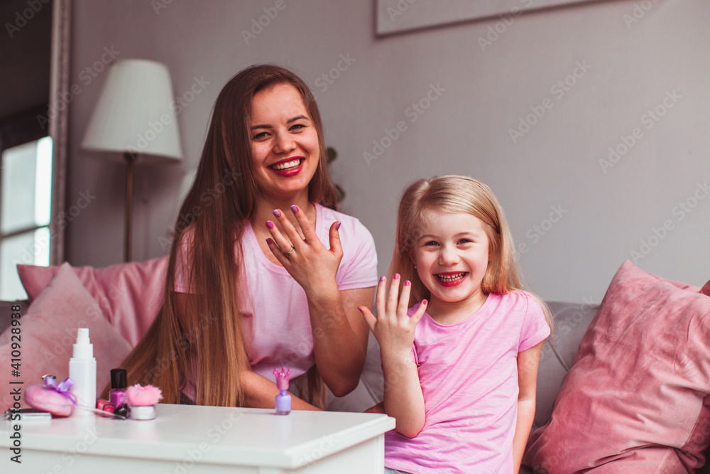 adult and little girls take care of their appearance Stock Photo ...