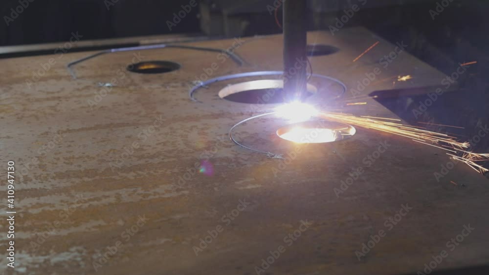 Cutting a metal sheet with a CNC cutting machine. Cnc cutting a metal ...