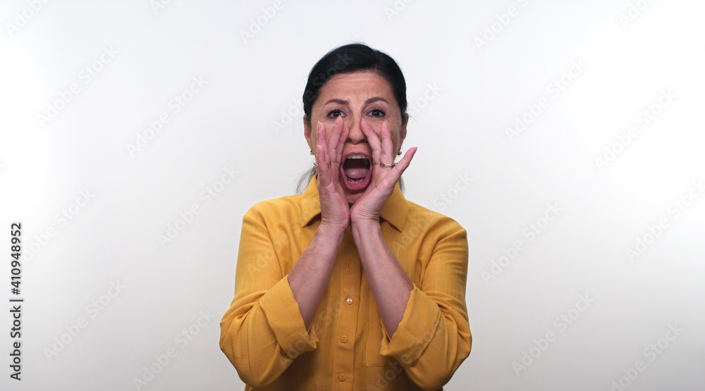 Angry, irritated old woman with an angry face looking angry and ...