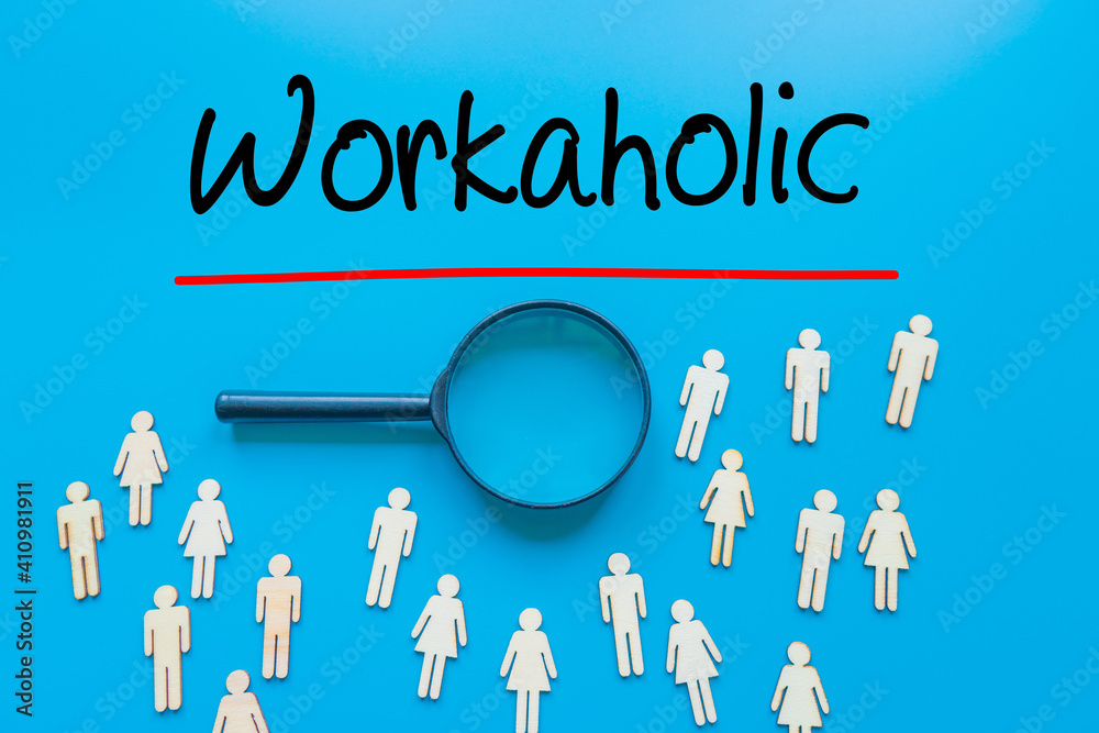 Workaholic Sign on white paper. Man Hand Holding Paper with text ...