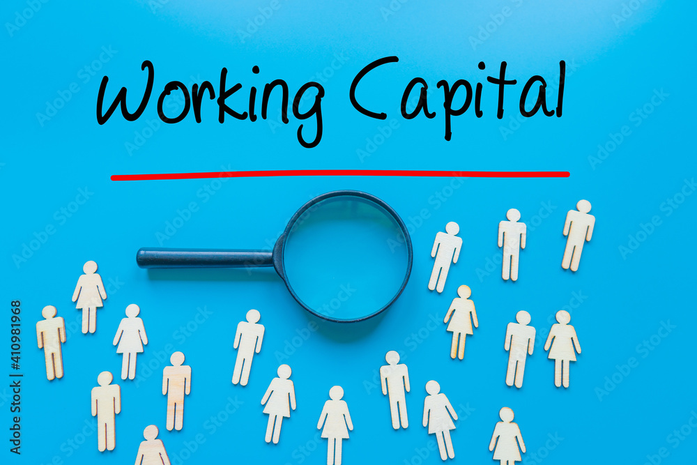 Working Capital Sign on white paper. Man Hand Holding Paper with text ...