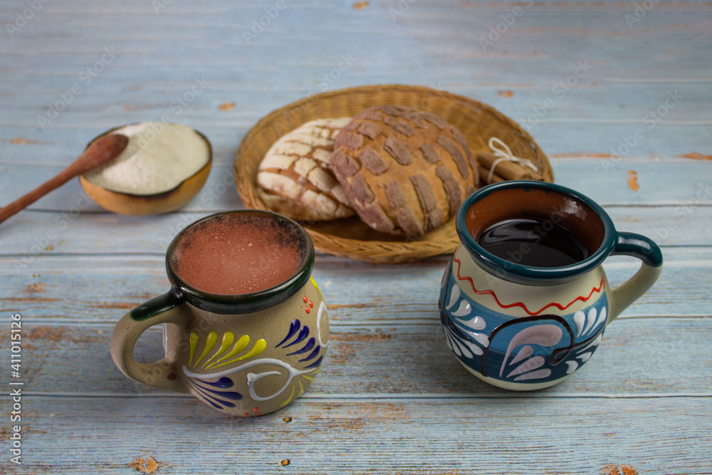 Mexican coffee and champurrado with traditional Mexican conchas bread ...