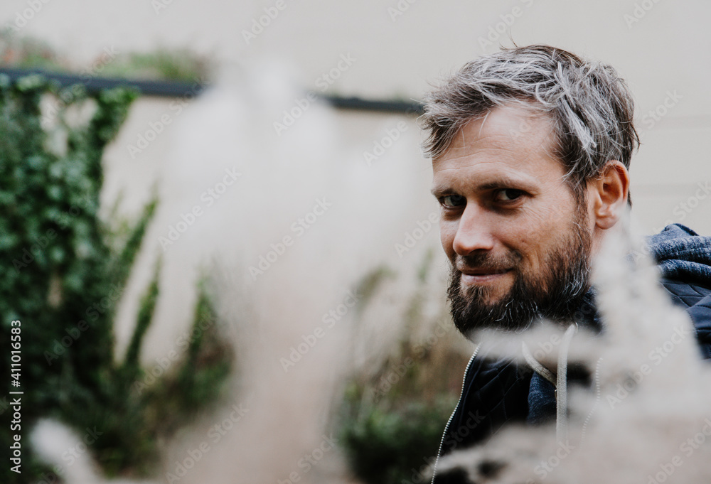Smiling Handsome Young Or A Middle Aged Caucasian Man Portraited In The