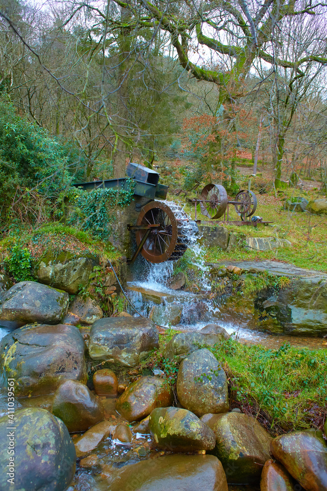Working water mill wheel with falling water in the village. Stock Photo ...