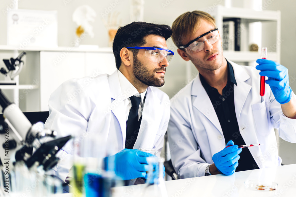 Professional two scientist man research and working doing a chemical ...