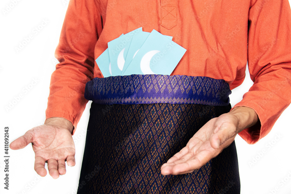 holding a pocket money envelope for muslim Eid celebration or also ...