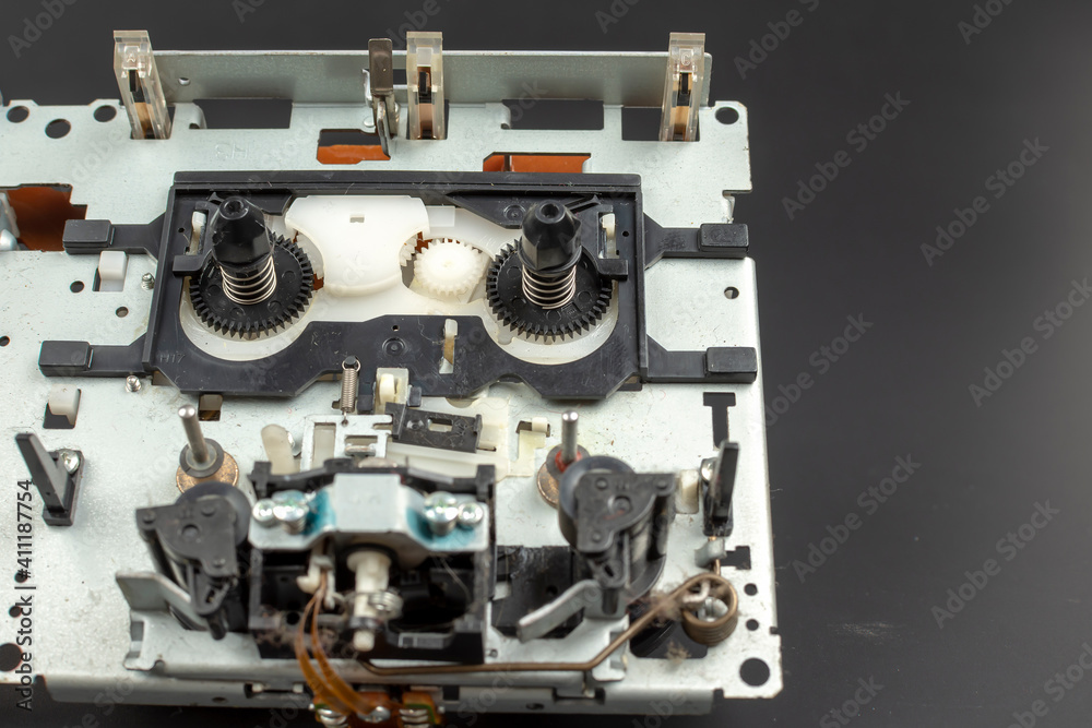 Mechanism for a tape recorder with gears in an exploded view close-up ...