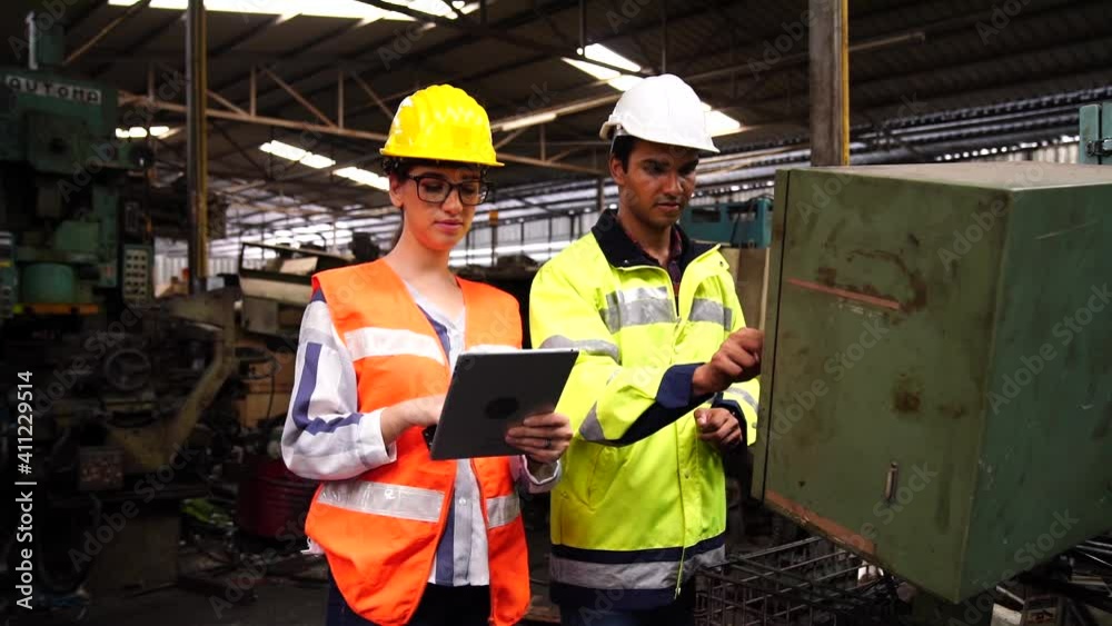 Professional technicians and engineers group wearing protective ...