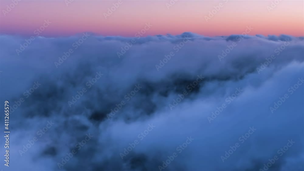Aerial view of blue misty clouds sky before sunrise Time lapse peaceful ...