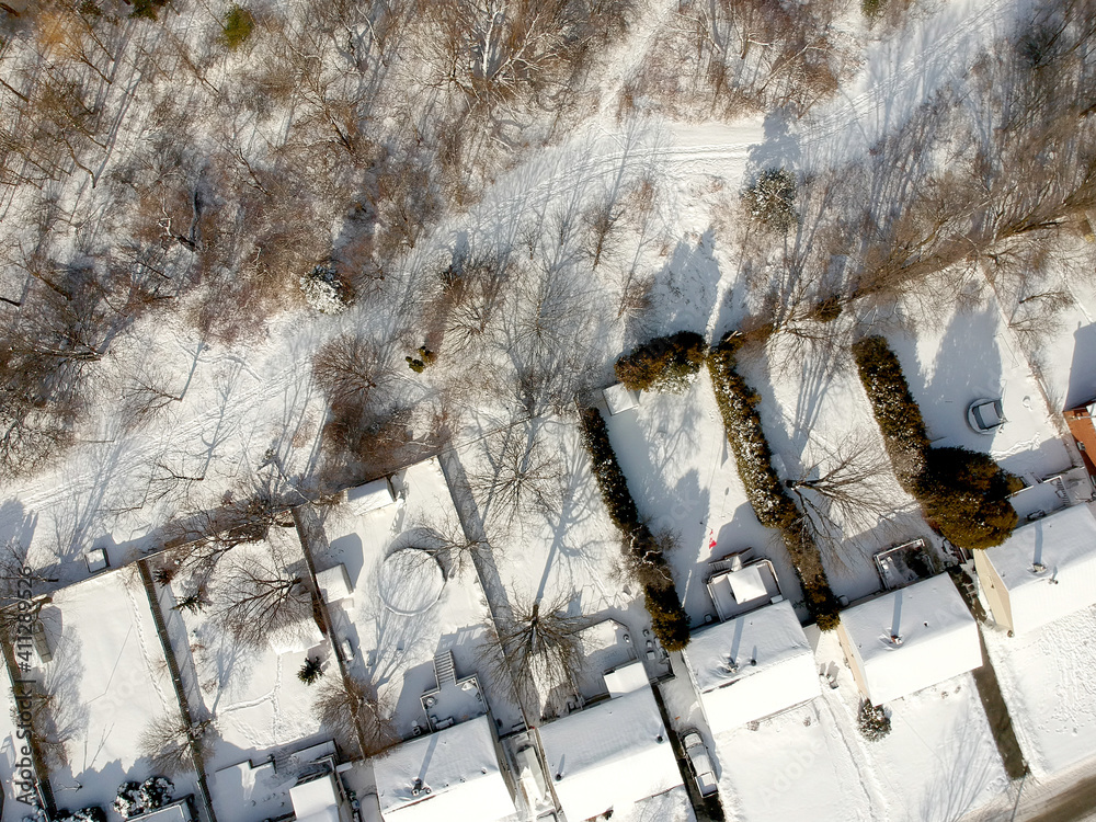Aerial drone view of roads and houses winter landscape. Winter city ...