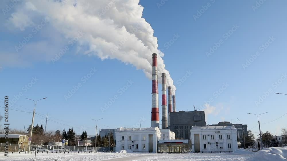 The chimneys of thermal power plants spew smoke into the air against ...