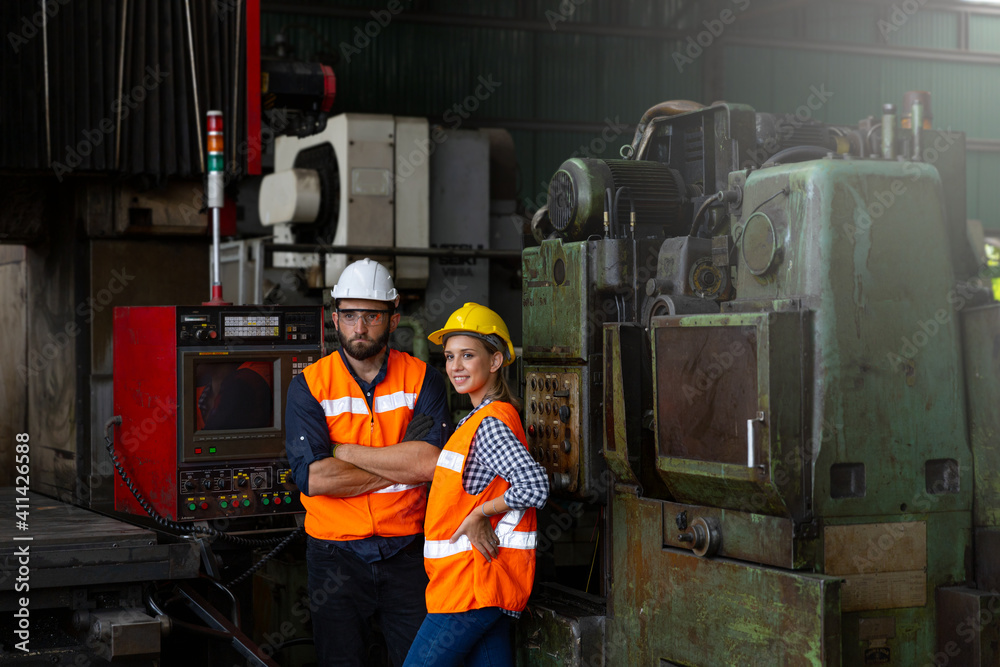 Team of female and male mechanical engineer or worker work together to ...