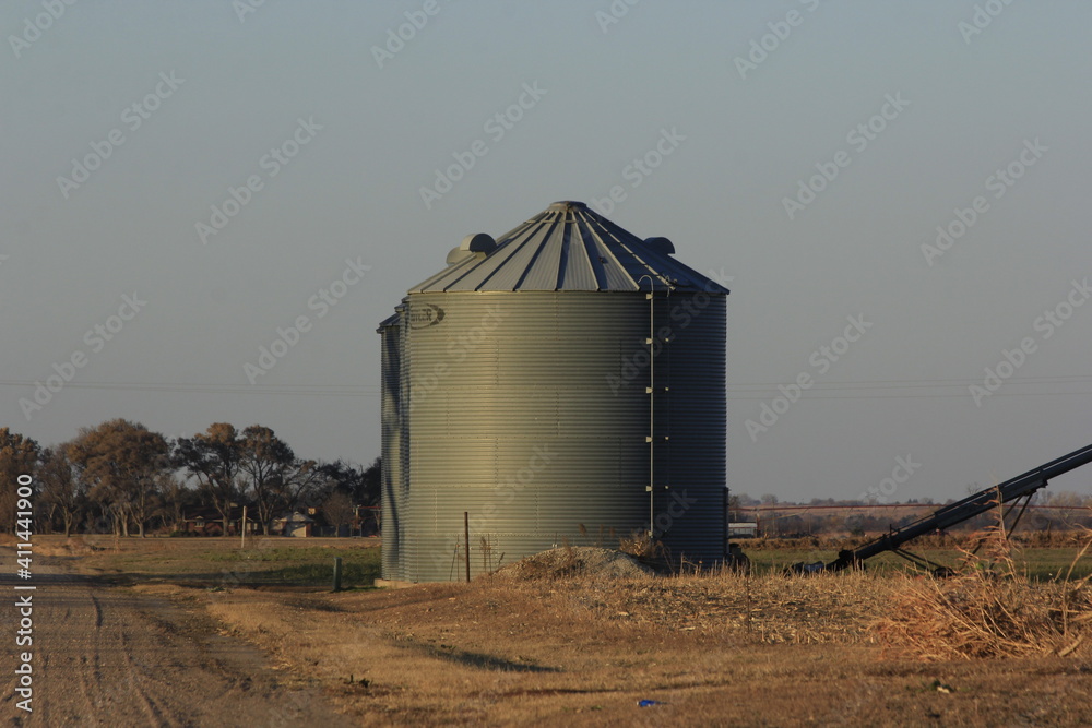 grain silos in the field with blue sky south of Lyons Kansas USA out in ...