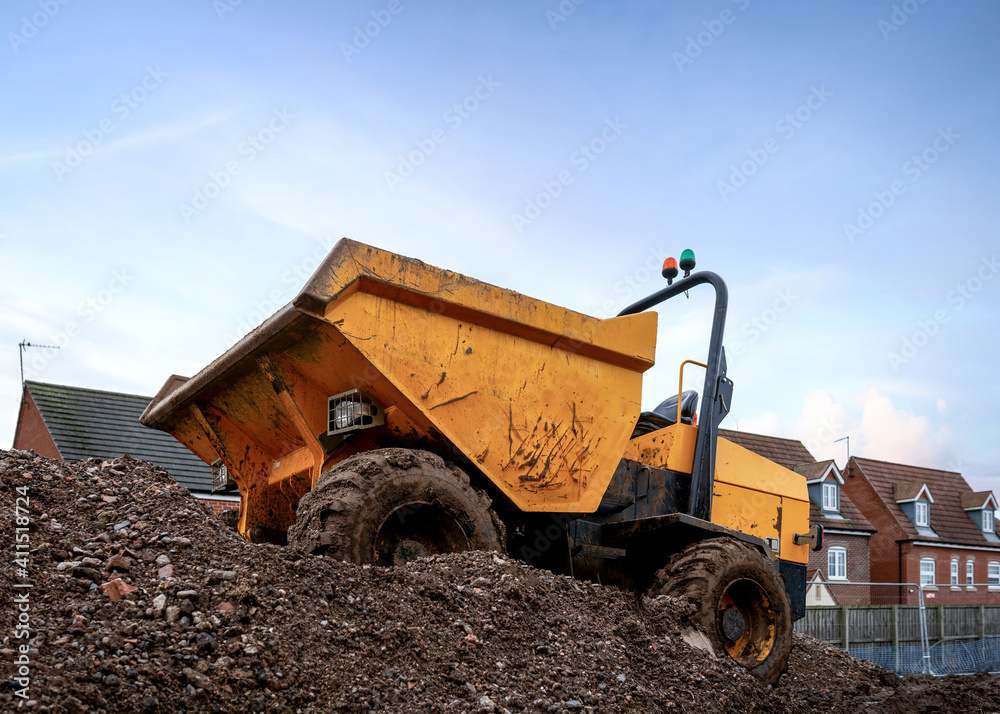 Mini yellow dumper with roll bar and orange flashing lights and tipper ...