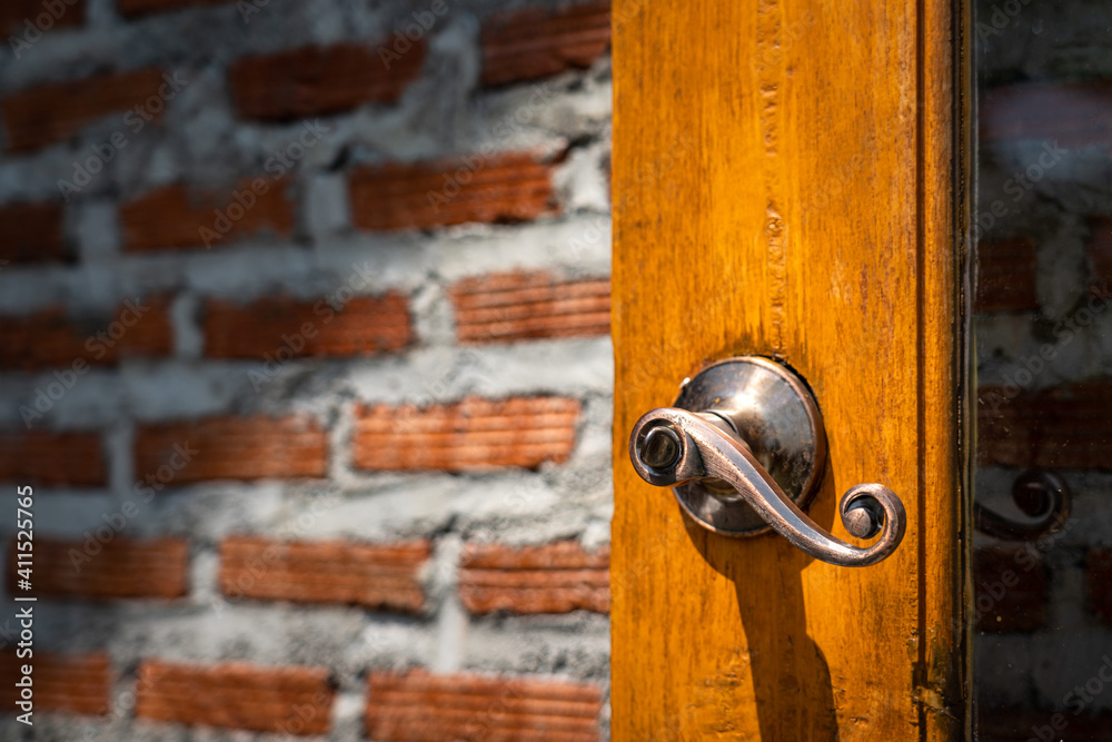 Classic designed door's handle which is made from shiny metal alloy ...