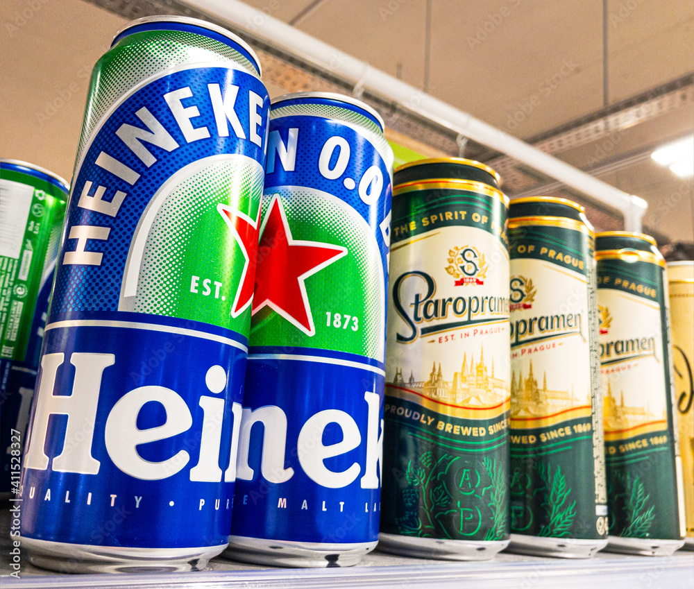 2021: Heineken and Staropramen beers in tin cans standing in ...