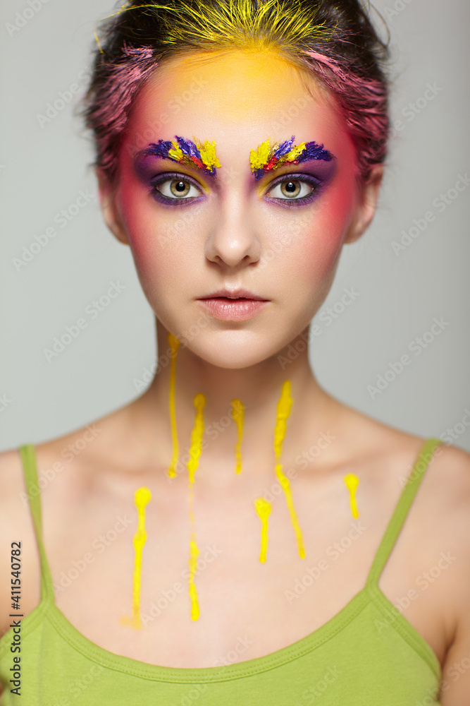Female portrait with unusual face art make-up. Paint on brows, hair ...