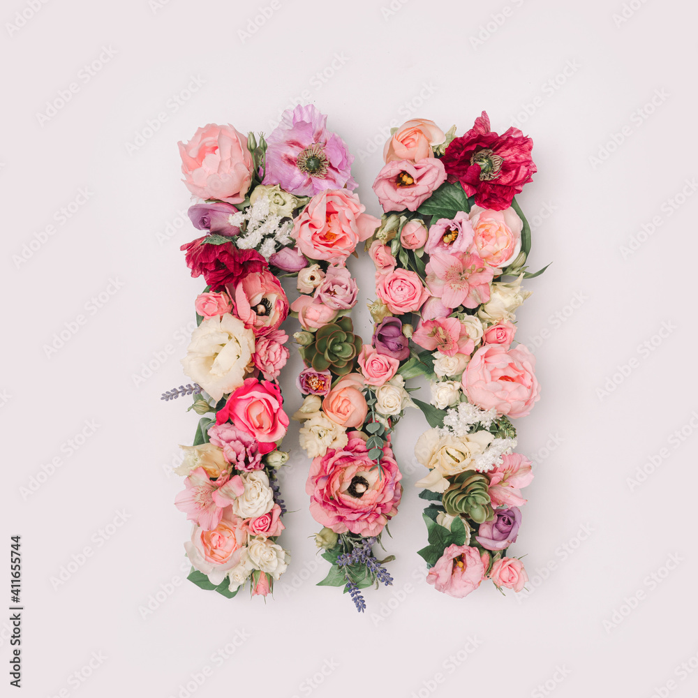 Letter M made of real natural flowers and leaves. Flower font concept ...