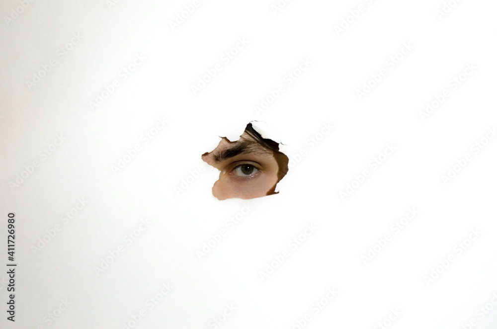 eye peeping into torn paper white background Stock Photo | Adobe Stock