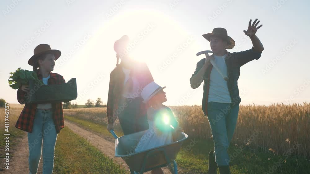 happy children of farmer work team with parents in field.little ...