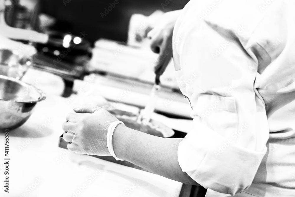 Chef cooking in a kitchen, chef at work, Black and White. Stock Photo ...