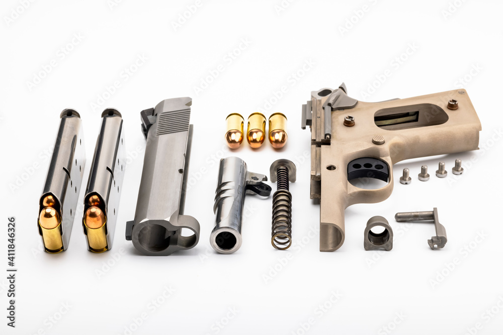 Parts of automatic pistol handgun with magazine on white isolated ...