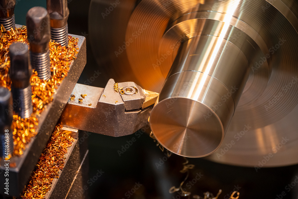 Fotografia do Stock: The operation of lathe machine cutting the brass ...