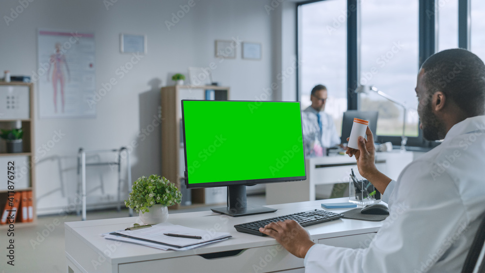 African American Medical Doctor is Making a Video Call with Patient on ...