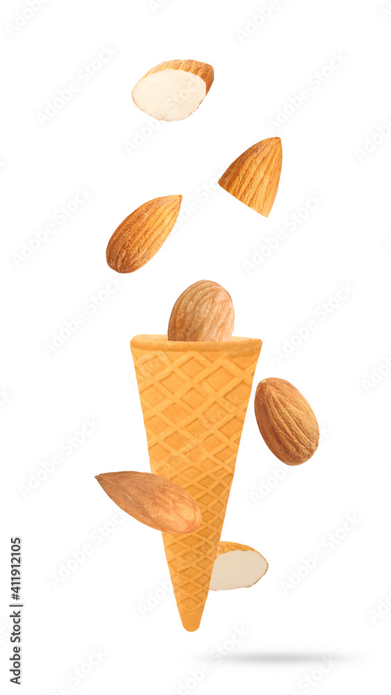 Isolated flying nuts. Seven whole and slices of almonds falling down in ...