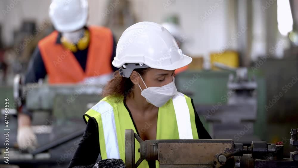 workers factory brazilian woman wearing Face Shield mask and working at ...