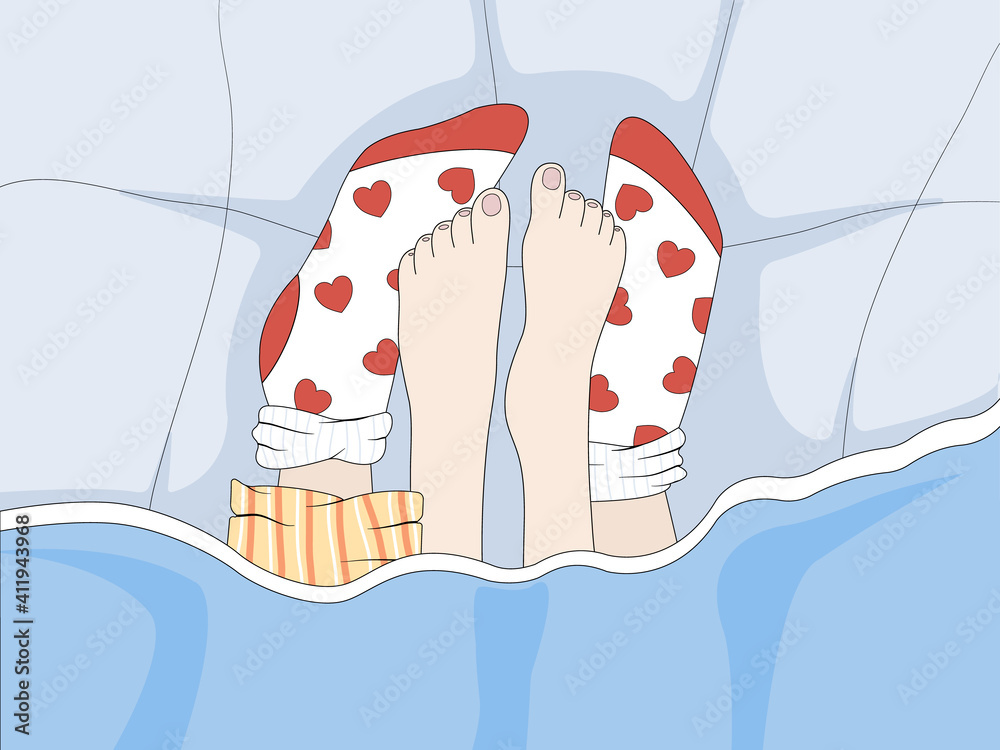 Legs in socks of lovers under the blanket. Posters with hugging couple ...