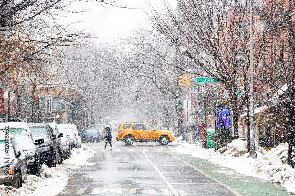 Snowy winter street scene at an intersection on 1st Avenue in the East ...