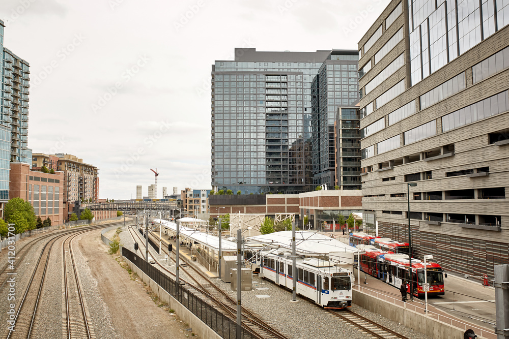 Lightrail and city buses in line near Union Station and the Millennium ...