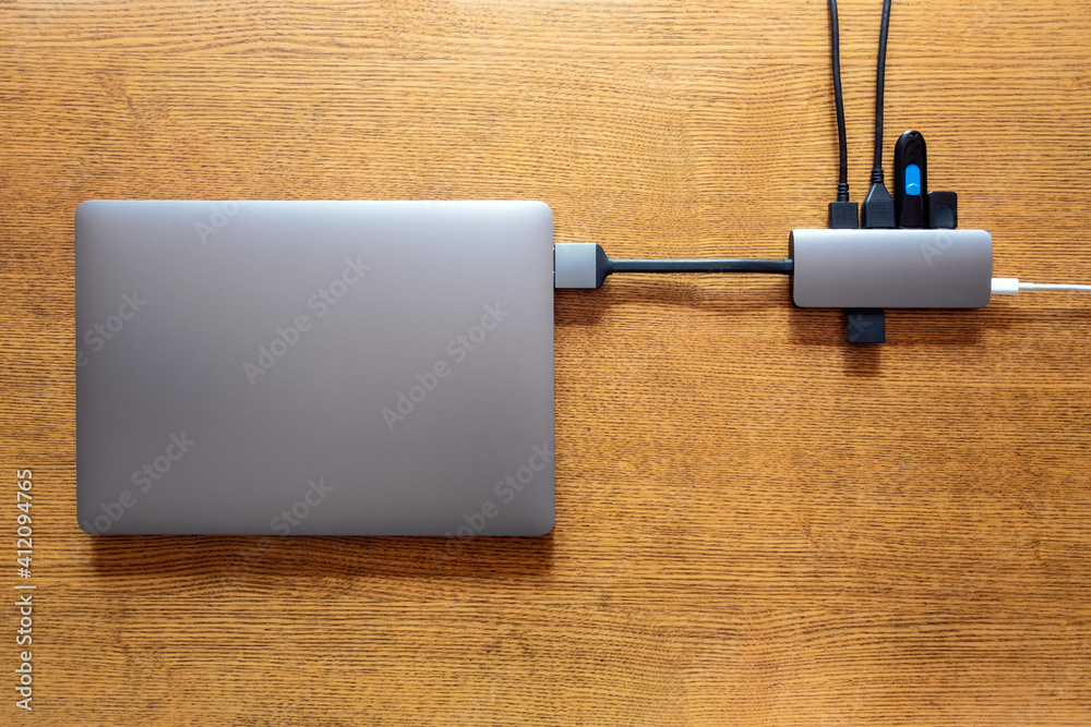 USB hub connected to laptop. Lack of hardware ports on modern laptops ...