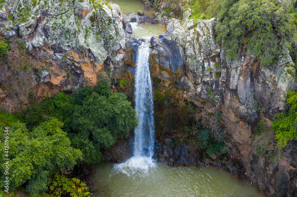 Waterfall with Rain and Snow waters plummeting down the stream ...