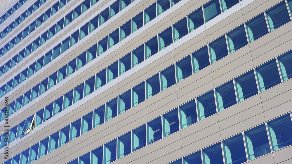 exterior facade of skyscraper building with glass windows all closed ...