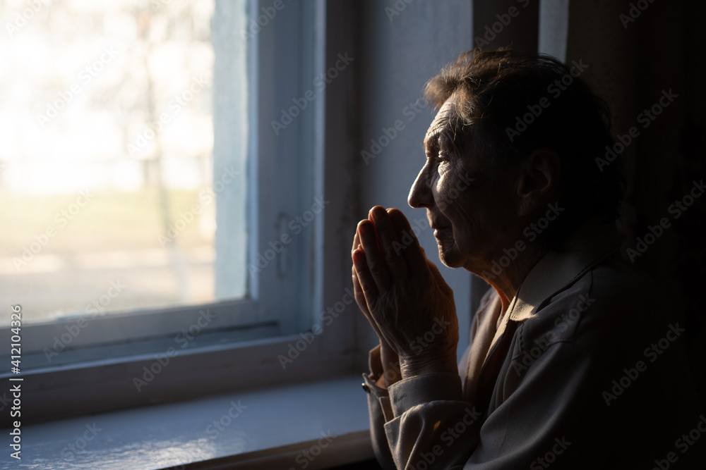 Very old woman is praying in her country style kitchen Stock Photo ...