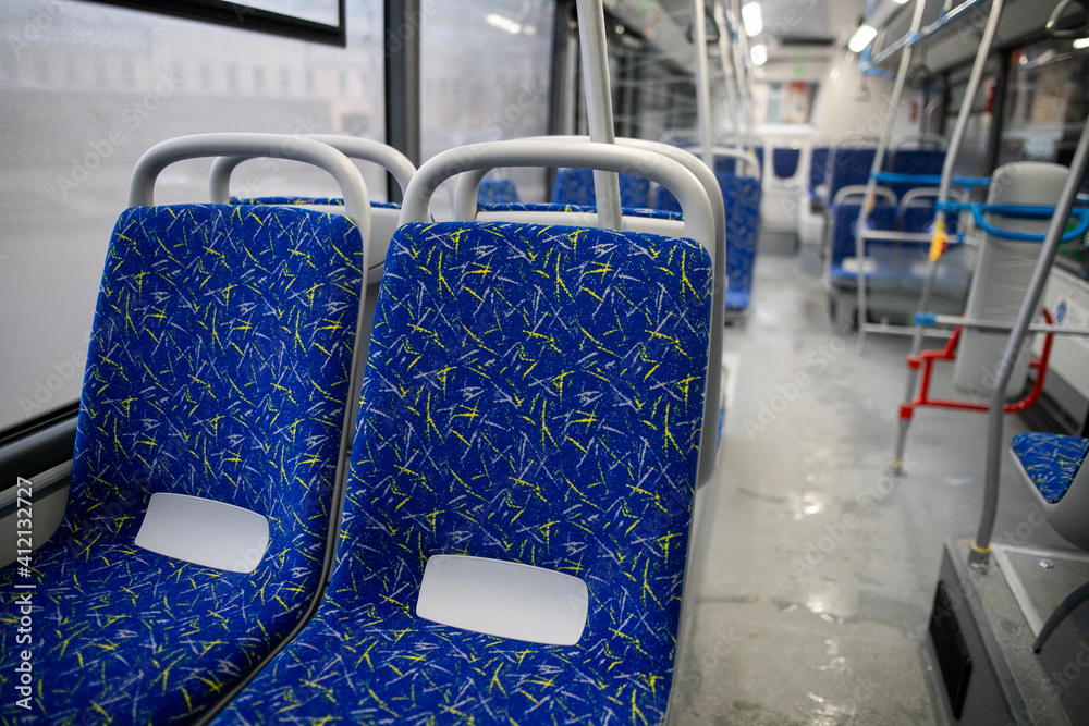 Empty bus interior. Blue seats without passengers. Public transport ...