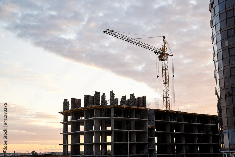 Construction site with huge multi-storey apartment buildings and crane ...